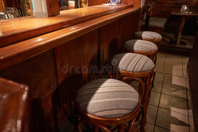 Bar stools at the counter stock image. Image of stool - 239098551 Bar stools at the counter stock image. Image of stool - 239098551