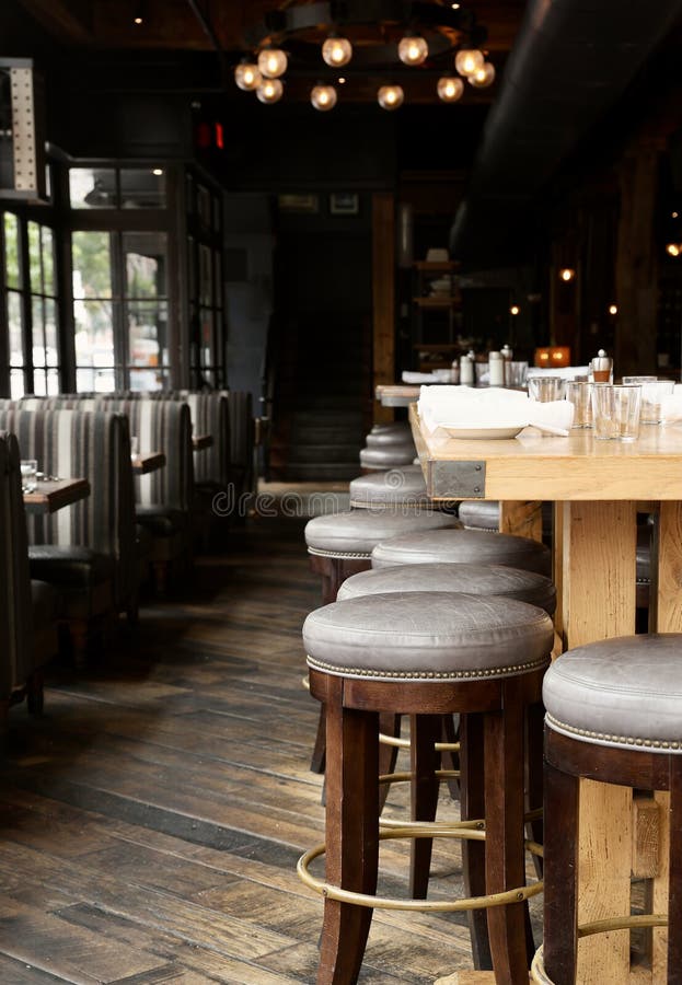 Bar Stools Lined Up Along the Long Counter Stock Photo - Image of ...