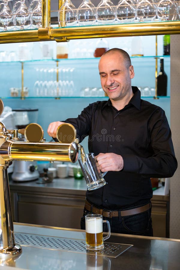 Bar Tender Filling Beer from Bar Pump Stock Photo - Image of counter ...