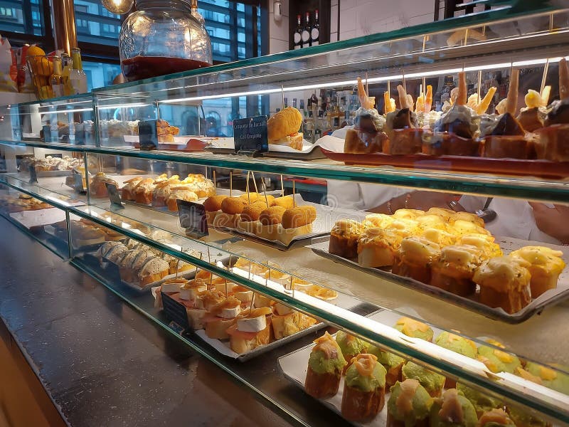 A Bar with a Three Level Display Case with a Wide Variety of Typical ...