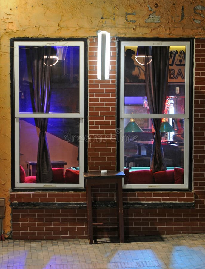 Bar windows at night stock photo. Image of town, exterior - 270963214