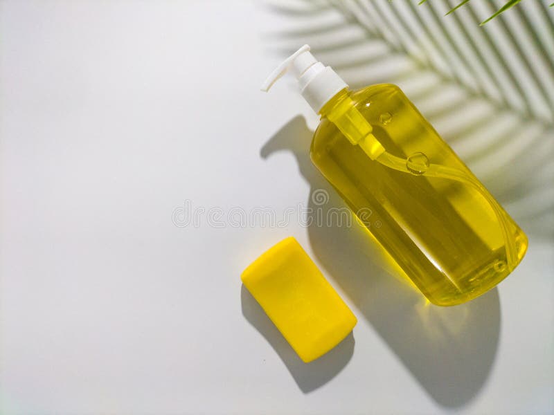 A Bar of Yellow Soap and Liquid Soap Bottle Stock Image - Image of ...
