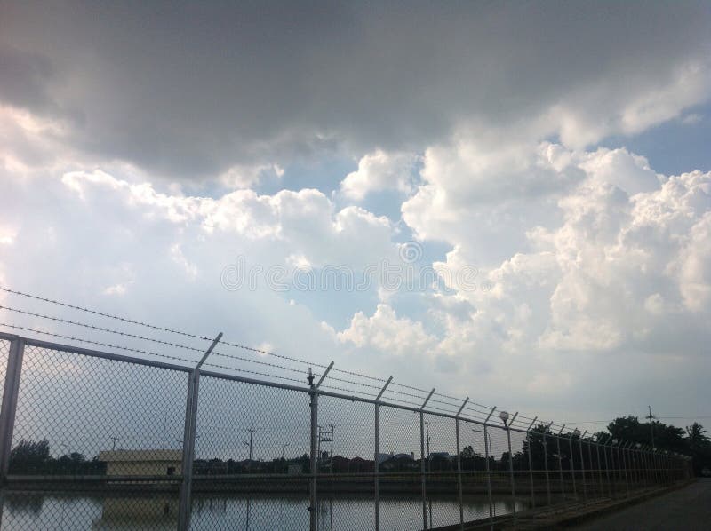 Barb wire and white cloud stock photo. Image of white - 43571044