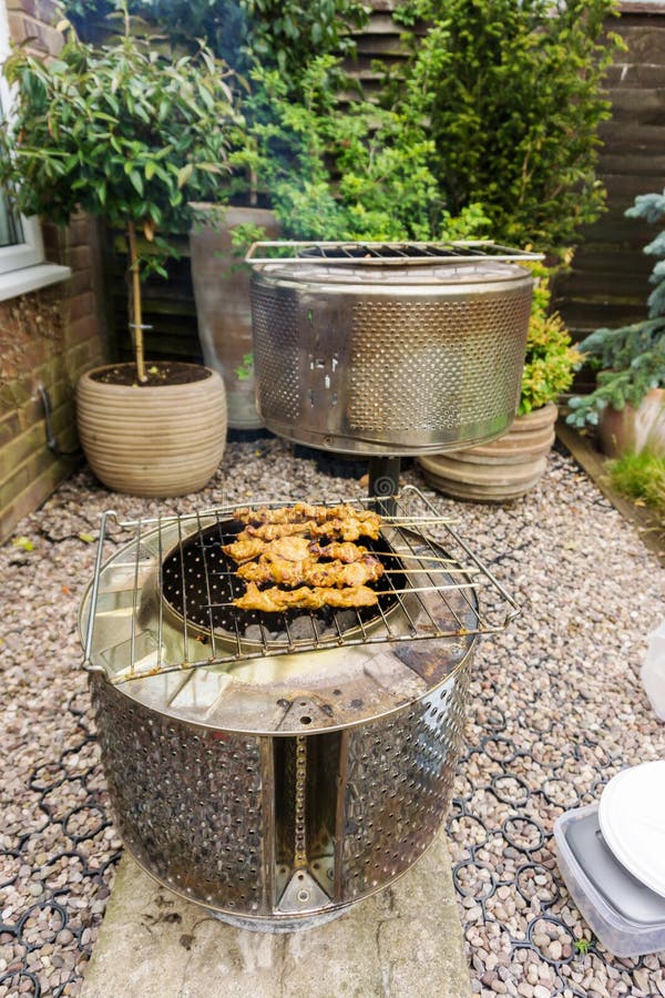 Barbecue in a back garden stock image. Image of washing - 87780051
