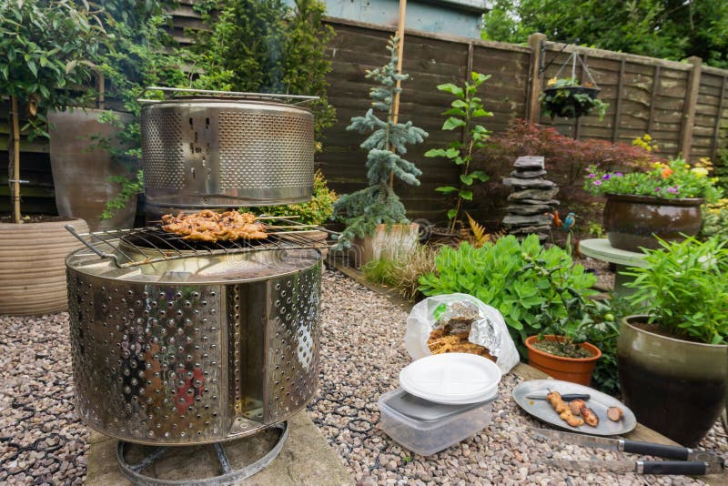 Barbecue in a back garden stock image. Image of back - 87780225
