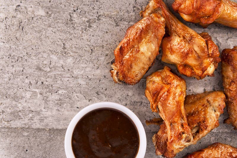 Barbecue Chicken Wings on a Concrete Texture in Background. Stock Image ...
