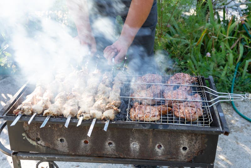 Barbecue on the Grill. Cooking Meat on the Grill Stock Photo - Image of ...