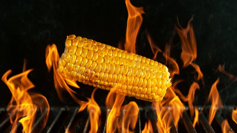 Barbecue Grill with Falling Corn Stock Photo - Image of grilling ...