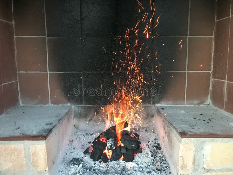 Barbecue Lit with Charcoal, with Sparks Flying in All Directions Stock ...