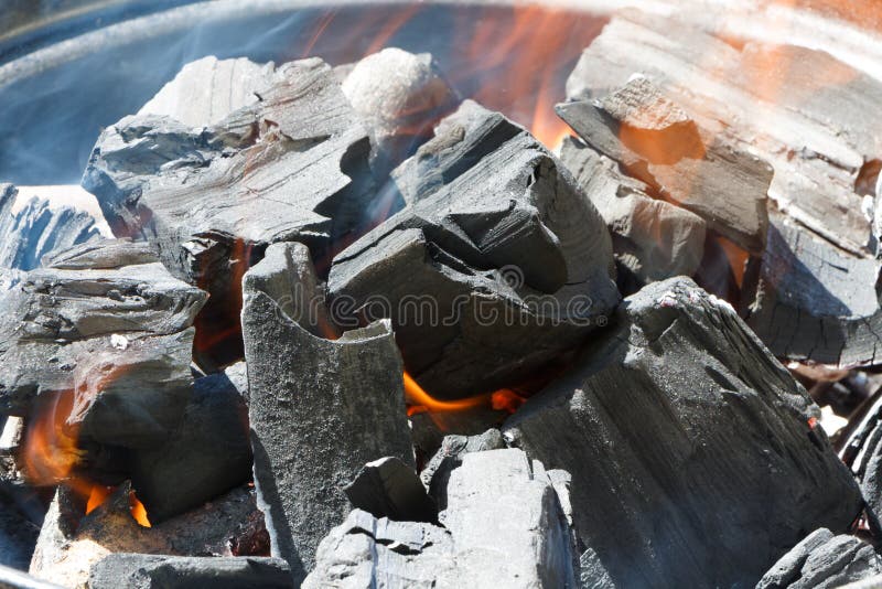 Barbecue lit in a garden stock image. Image of ember - 154418077