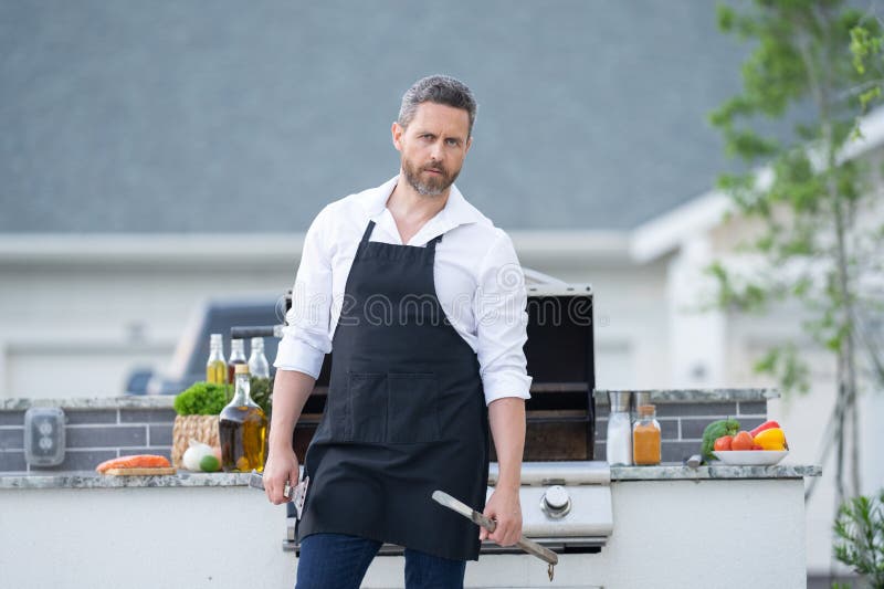 Barbecue Master. Middle Aged Hispanic Man in Apron for Barbecue ... Barbecue Master. Middle Aged Hispanic Man in Apron for Barbecue ...