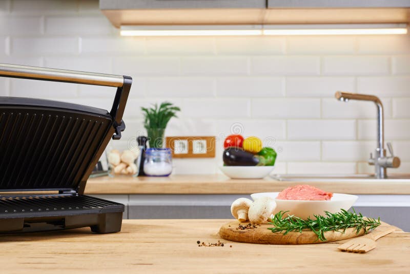 Barbecue Preparing in the Kitchen Interior. Electric Grill Barbecue and ...
