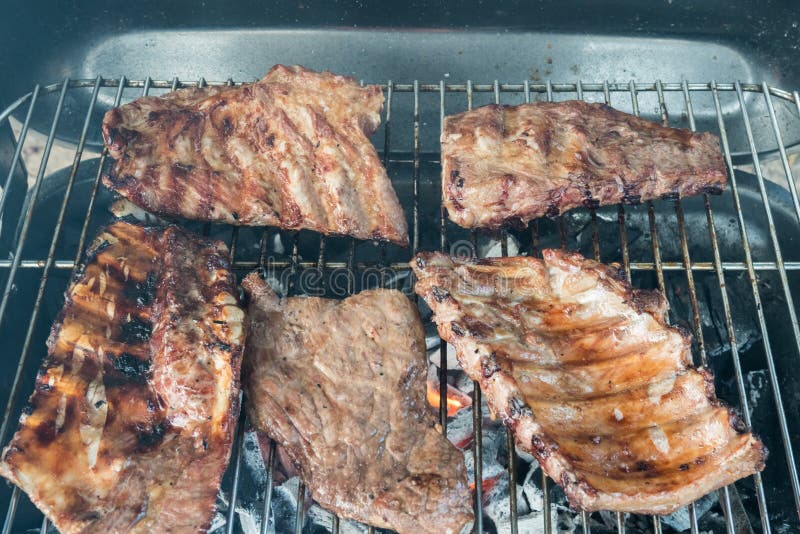 Barbecue with Ribs and Steak Stock Image - Image of pork, roast: 116932105