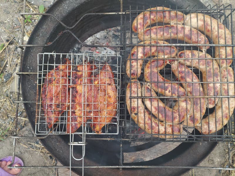 Barbecue with Sausages and Meat on Grill, Top View Stock Photo - Image ...