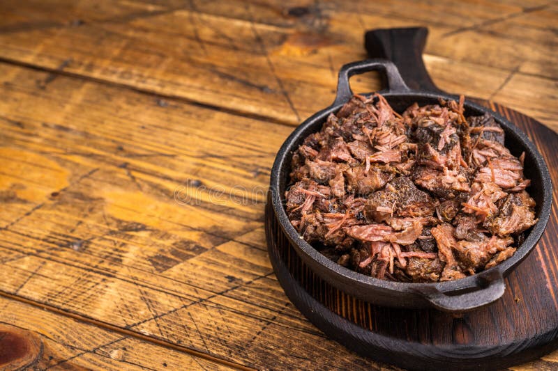 Barbecue Wagyu Meat Torn To Bits Pulled Beef in a Skillet. Wooden ...