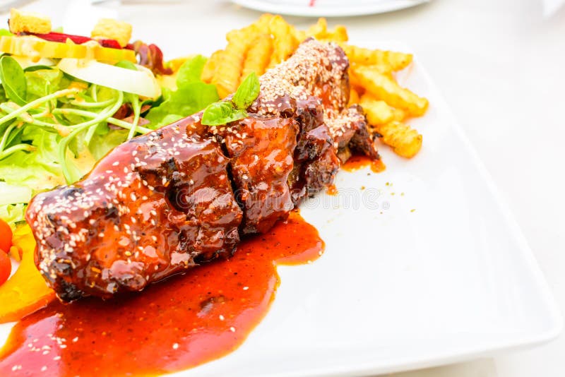 Barbecued pork spare ribs stock photo. Image of plate - 48724108