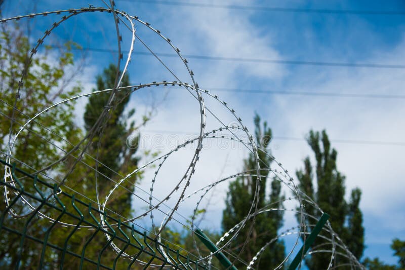 Barbed Fence Around Prison Walls Stock Photo - Image of wire, barrier ...