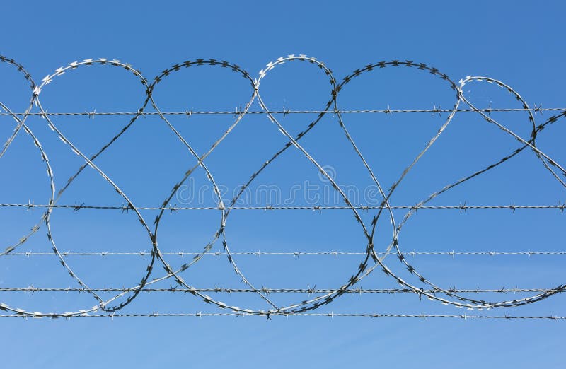 Barbed and razor wire stock photo. Image of safety, enclosure - 76627476
