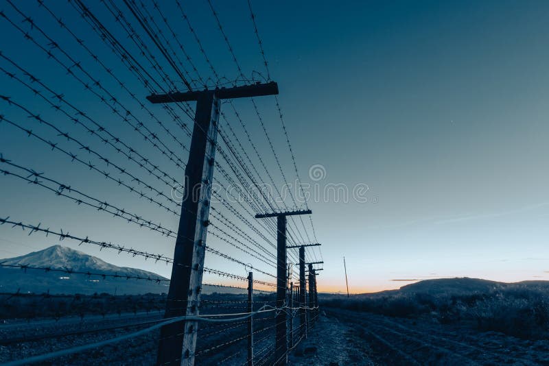Barbed Wire Along the Field Stock Photo - Image of sunset, barbed ...