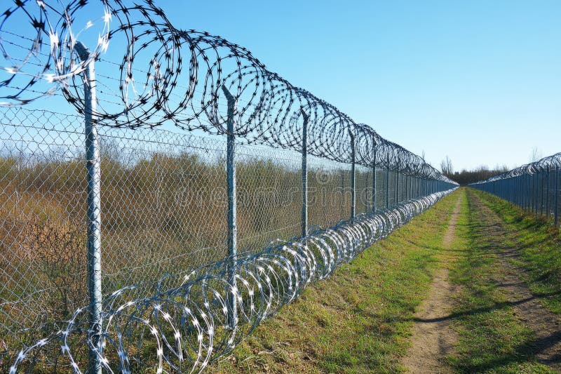 Barbed Wire and Chain Link Fence are Creating a Secure Perimeter Under ...
