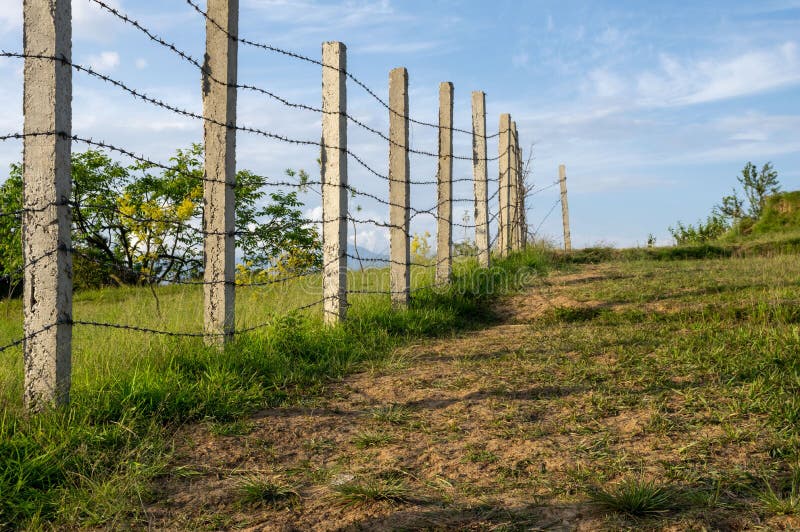 Barbed Wire on Concrete Posts Stock Photo - Image of clouds, danger ...