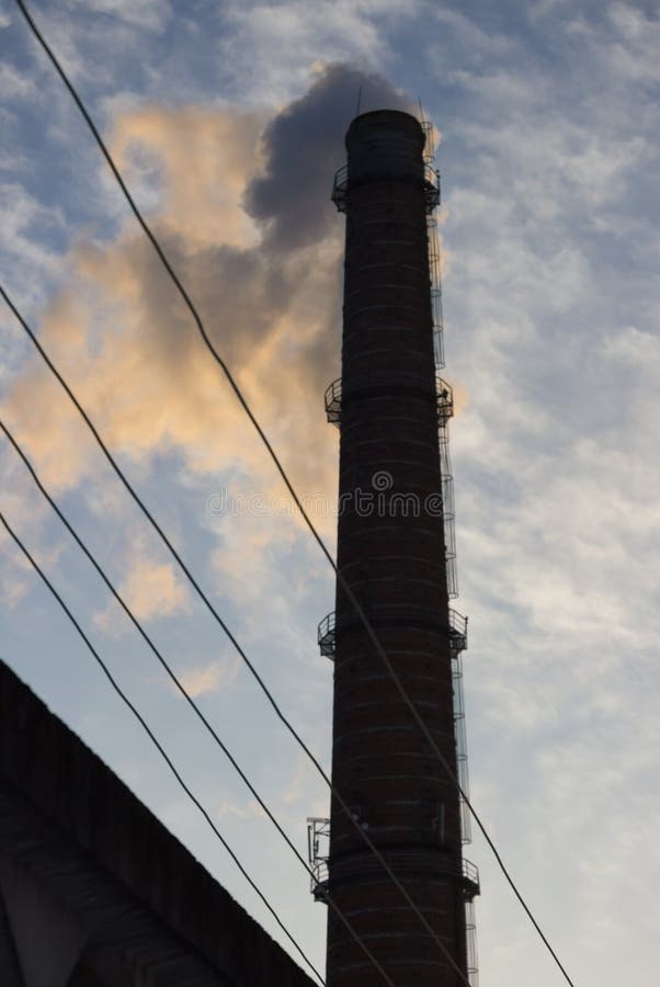 Barbed wire, factory pipe stock image. Image of pollution - 76071971
