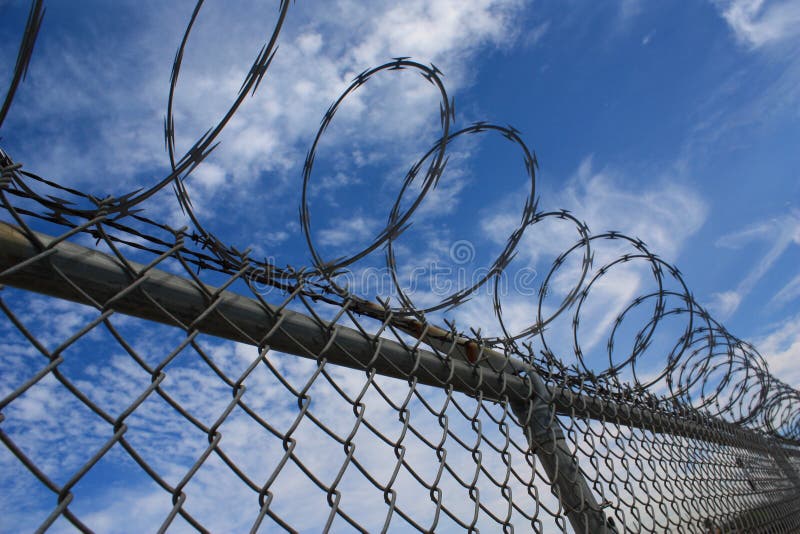 Security Fence with Barbed Wire Stock Photo - Image of penitentiary ...