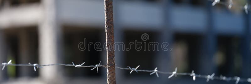 Barbed Wire Fence in Front of Prison Building Closeup Stock Photo ...