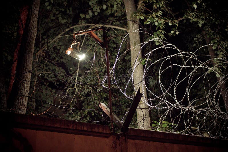 Barbed Wire on the Fence at Night Stock Photo - Image of fence ...