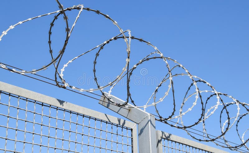 Barbed Wire Fence of the Prison Stock Photo - Image of jail, building ...