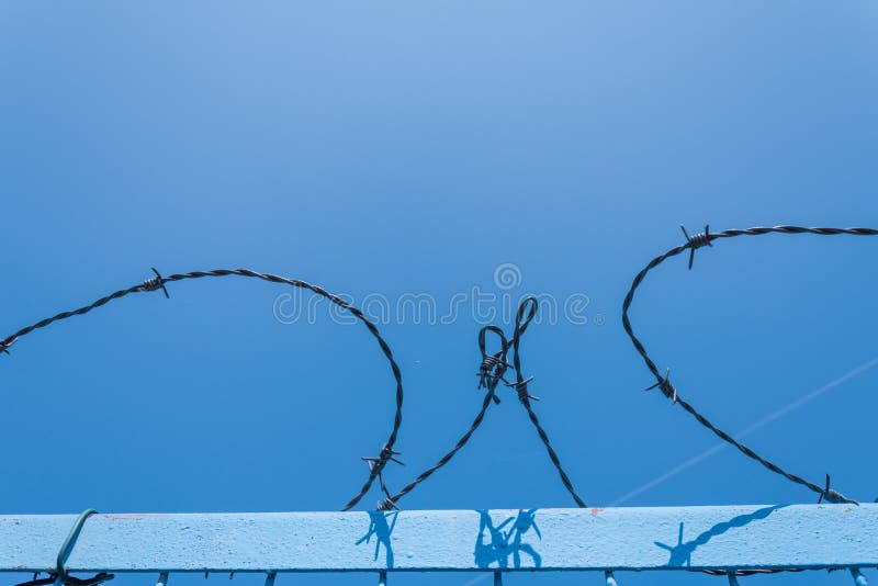 Barbed wire at a gate stock image. Image of blue, entry - 115368103