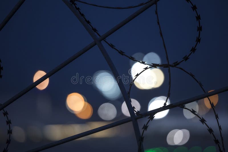 A barbed wire night blur stock image. Image of metal - 90133187