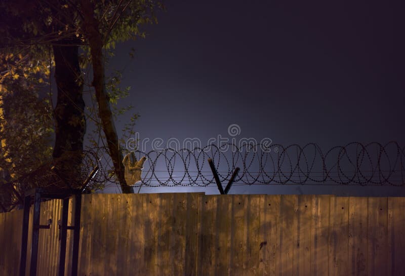 Barbed wire at night stock image. Image of enclosure - 35646293