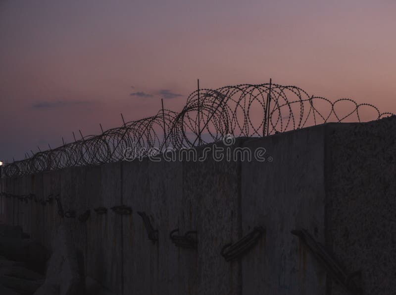 Barbed Wire Prison Wall. Sunset. Panorama. Stock Image - Image of ...