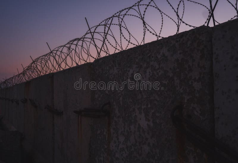 Barbed Wire Prison Wall. Sunset. Panorama. Stock Image - Image of sign ...