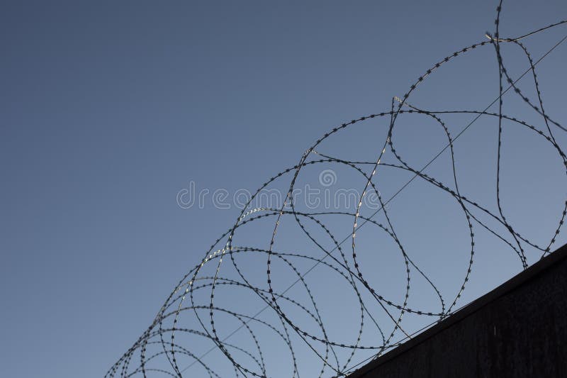 Barbed Wire Rings on Fence. Protected Area Stock Image - Image of spike ...