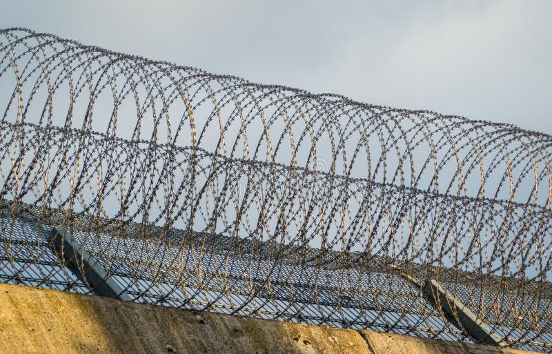 Barbed Wire Rolls on the Wall Edge of a Prison in Germany Stock Photo ...