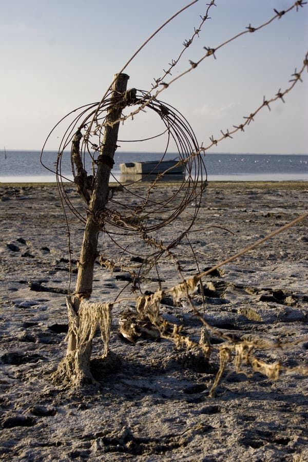 Barbed Wire by the Sea and Boat Stock Photo - Image of retro, landscape ...