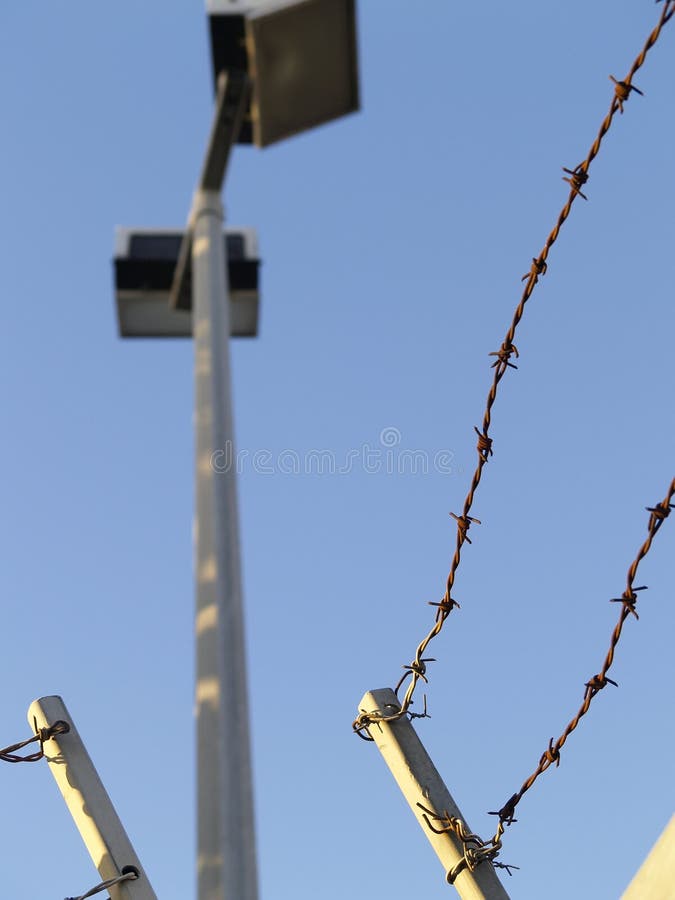 Barbed Wire Security Fence from Low Point of View Stock Photo - Image ...