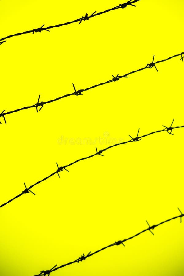 Barbed Wire Silhouette Against Yellow Background Stock Photo - Image of ...