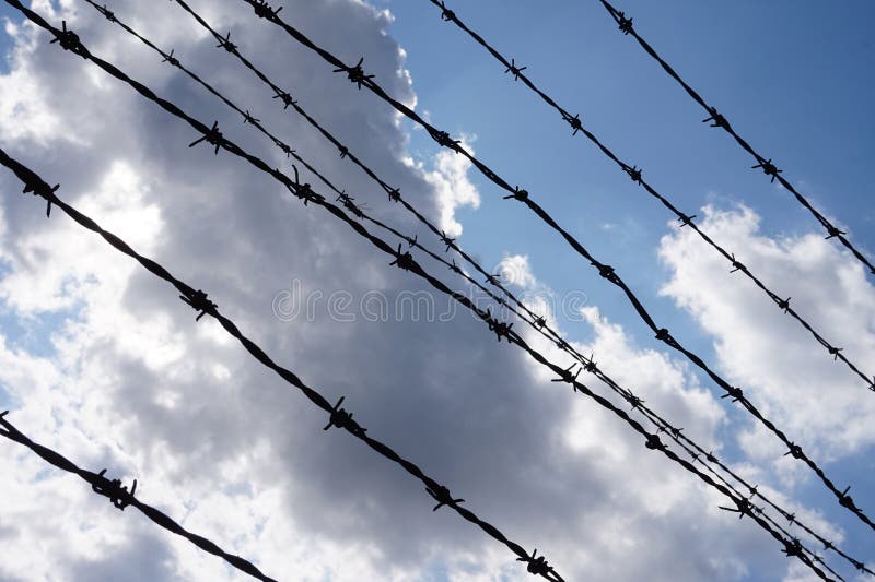 Barbed Wire, Sky in Background - Prison/ Jail Stock Photo - Image of ...