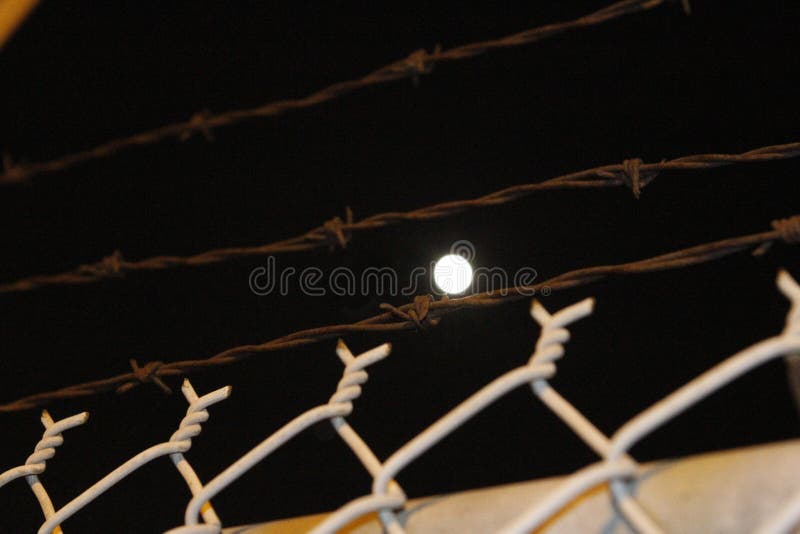Barbed Wire Under a Full Moon. Stock Photo - Image of security ...