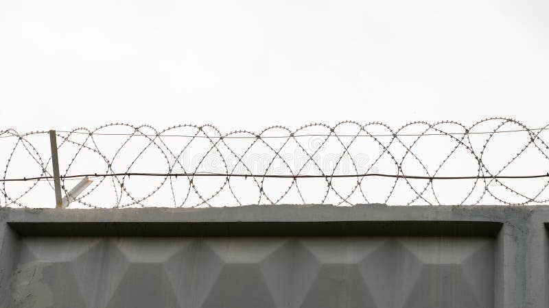 Barbed wire wall stock photo. Image of design, barb - 185208314