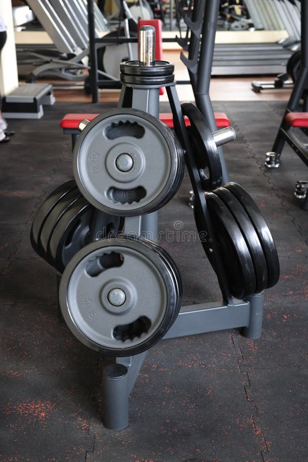 Barbell plates rack stock image. Image of metal, steel - 37703757