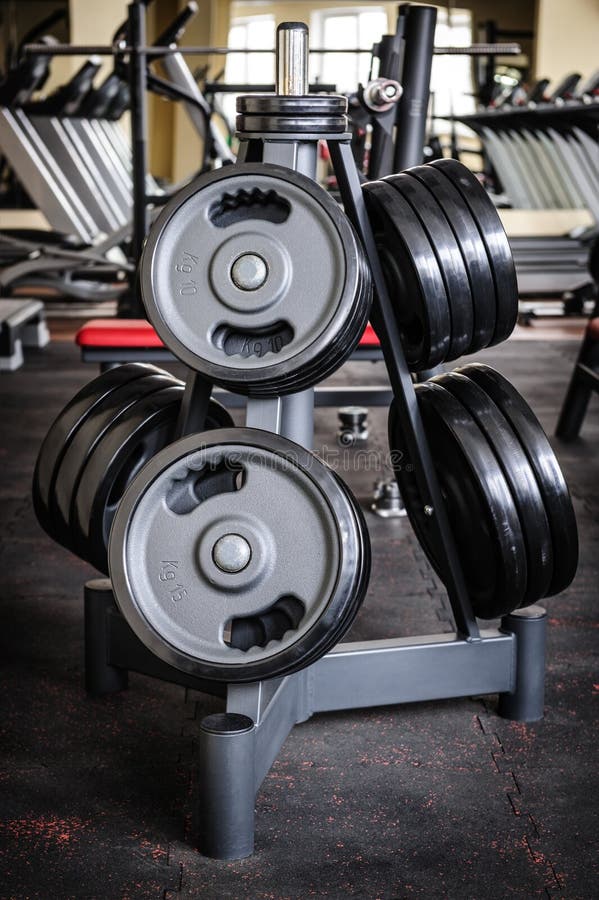 Barbell plates rack stock image. Image of interior, mass - 49391063