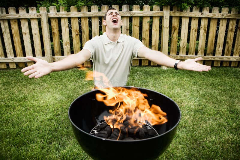 Barbeque: Man Prays To God of Fire Stock Image - Image of yelling ...