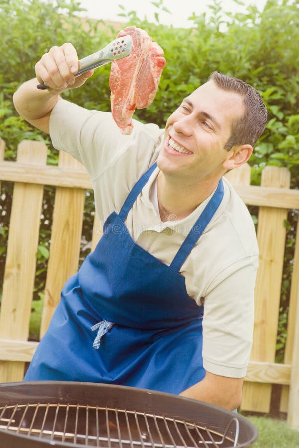 Barbeque: Man Ready To Cook Steak Stock Image - Image of fence, smile ...