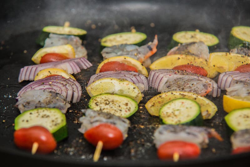 Barbeque Sticks with Meat, on the Grill and Heavy Smoke Above Brazier ...
