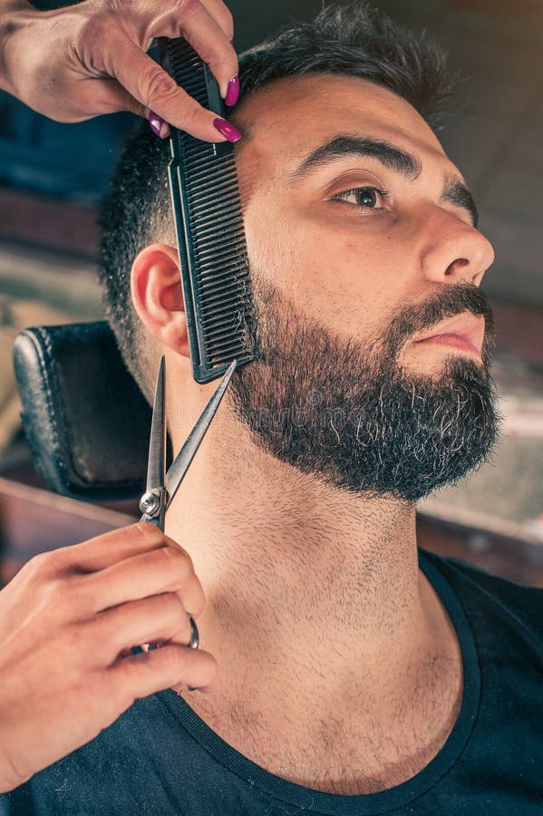 Barber Beard Cut a Client S Beard with Clippers Stock Photo - Image of ...