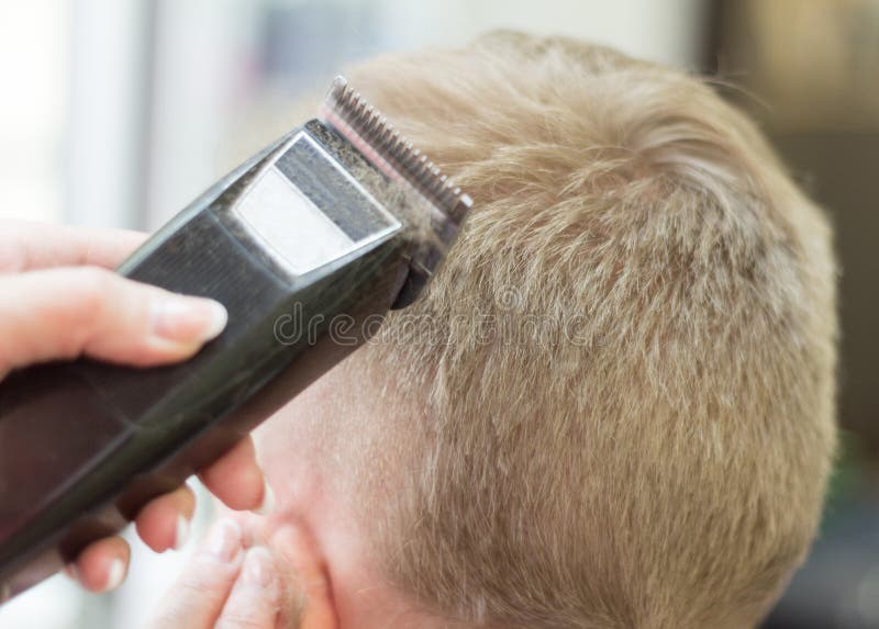 The Barber Cuts the Boy Trimmer Stock Photo - Image of young, barber ...